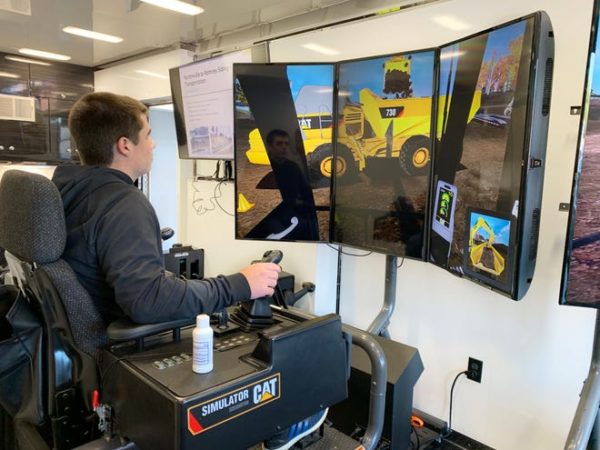 MHS students get to work with heavy equipment - Cat® Simulators